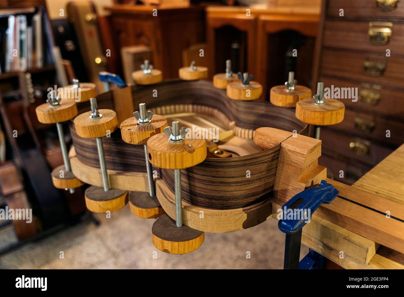 Process of making acoustic guitar with wood in a traditional workshop ...