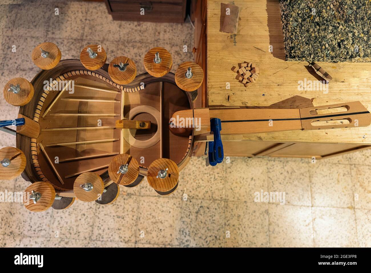 Top view of the process of making acoustic guitar with wood in a ...