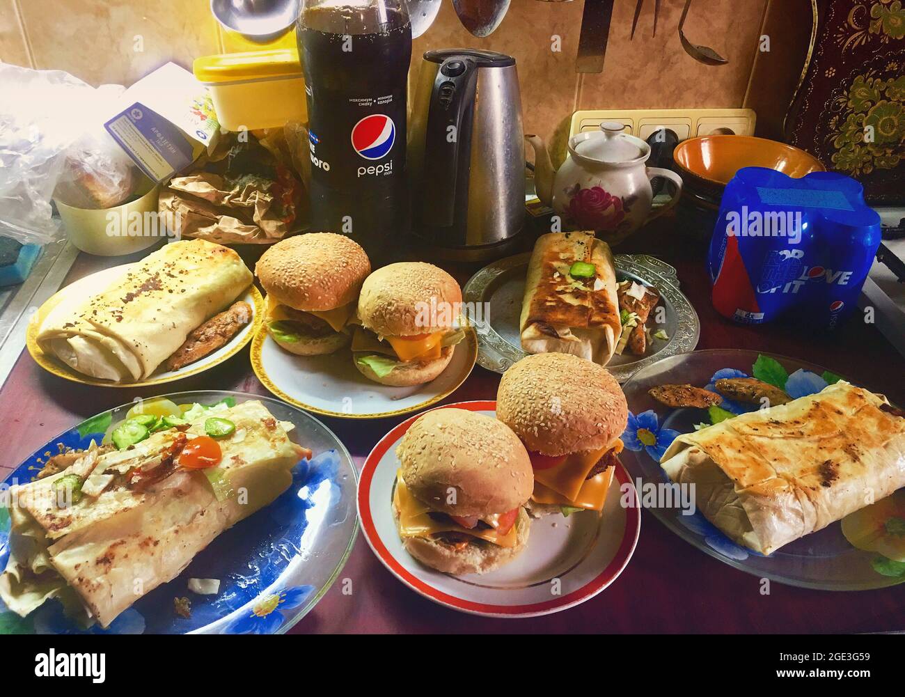 Chernihiv, Ukraine - August 3, 2019: Food on the table. Burgers and ...