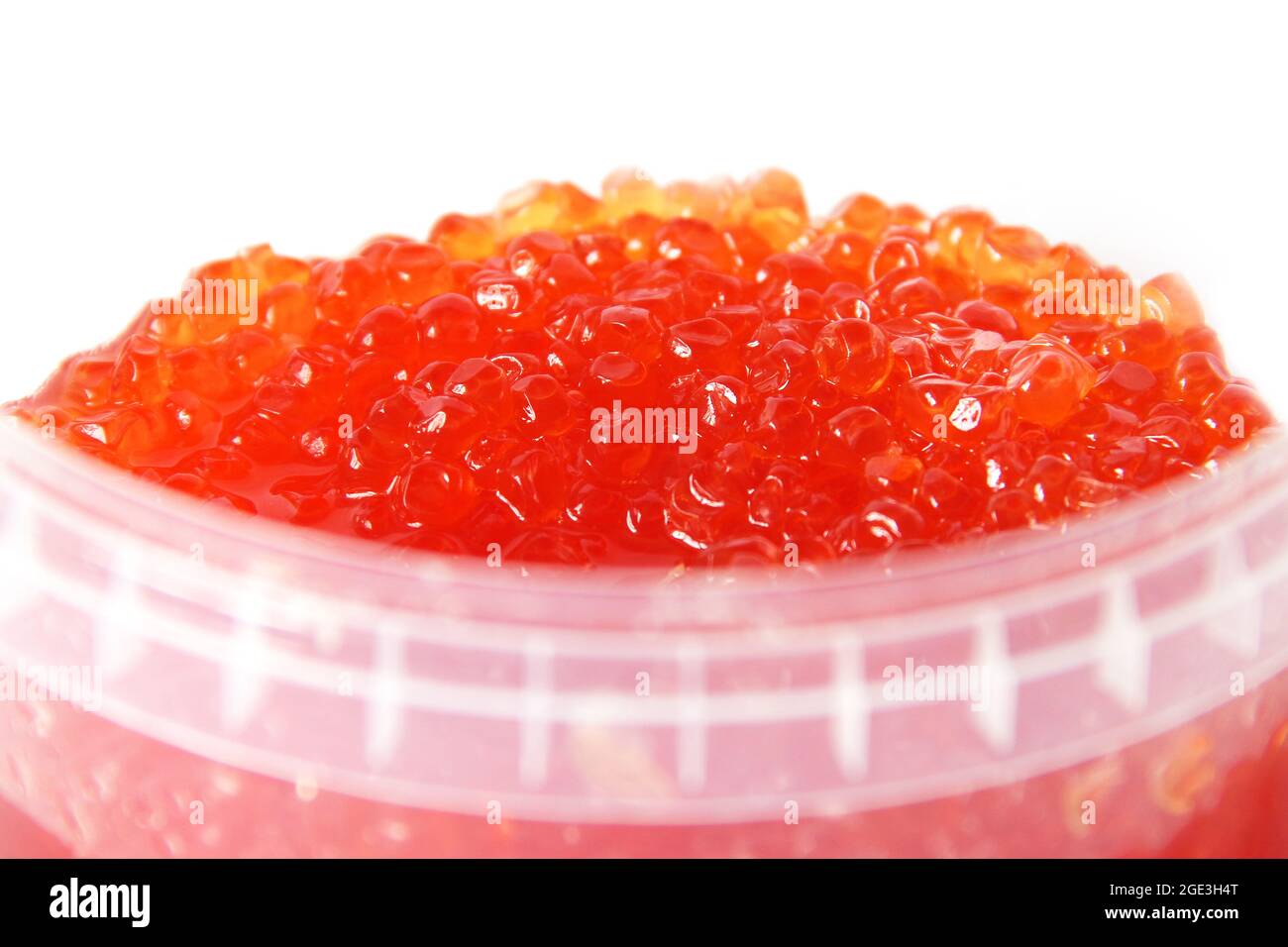 Red caviar in a plastic container on a white background. Caviar storage ...