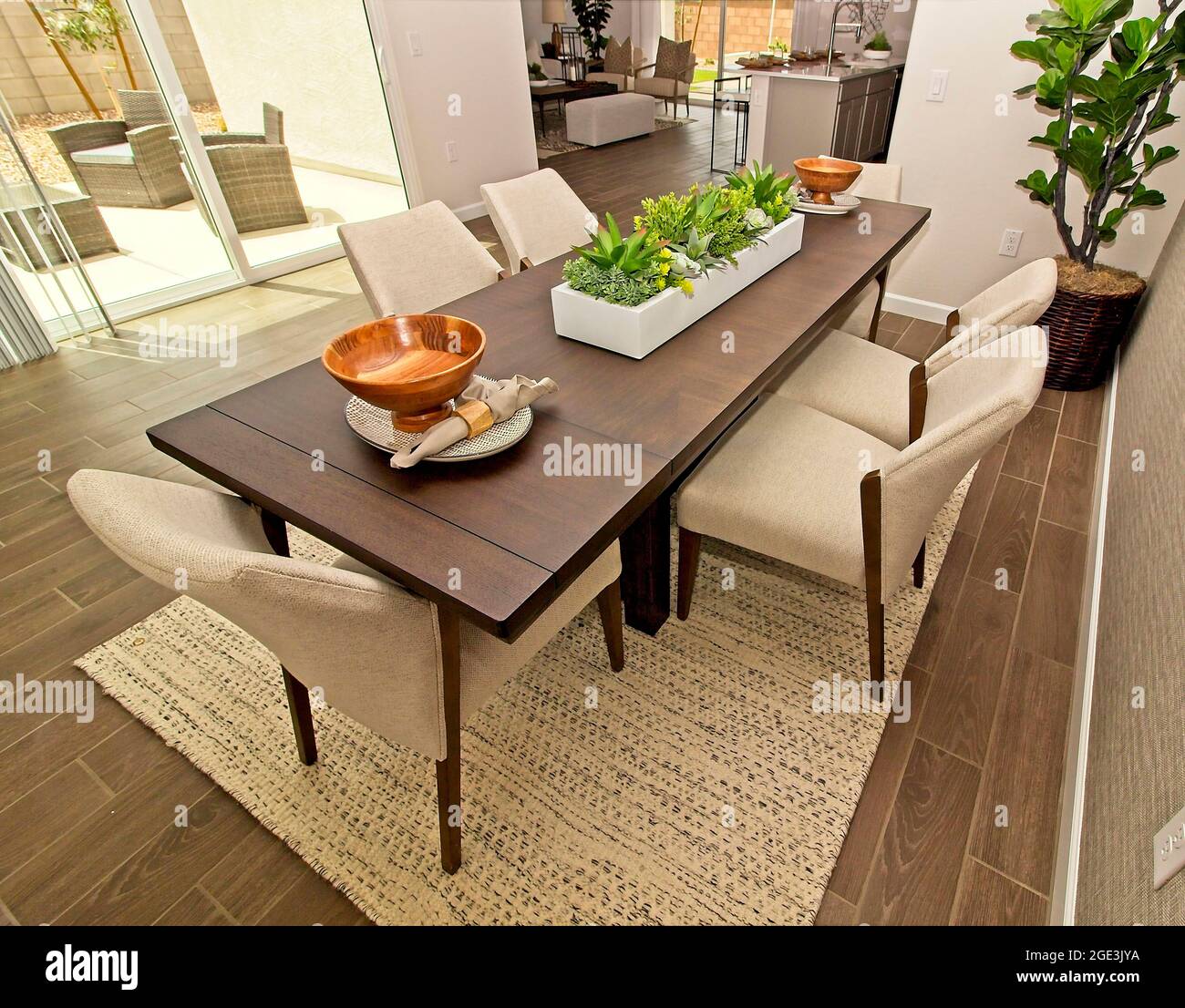 Dining Area With Long Table And Six High Back Chairs Stock Photo - Alamy
