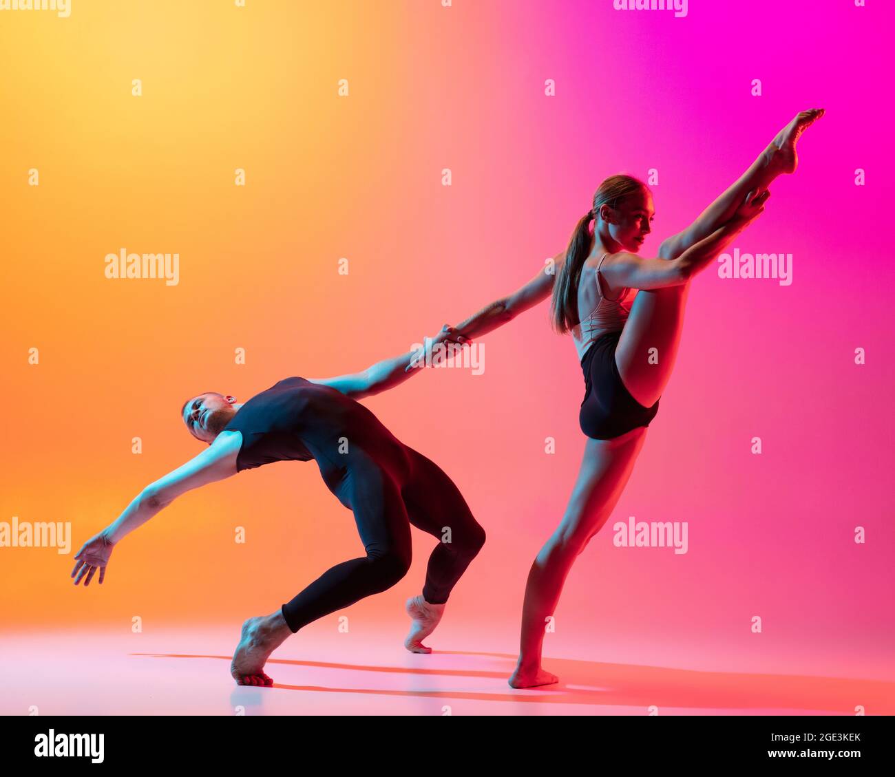 Two dancers, stylish sportive couple, male and female models dancing ...