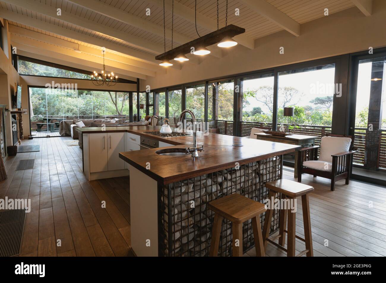 Interior of open plan kitchen diner and living room of comfortable home ...