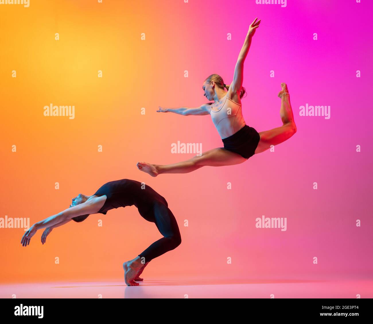 Two dancers, stylish sportive couple, male and female models dancing ...