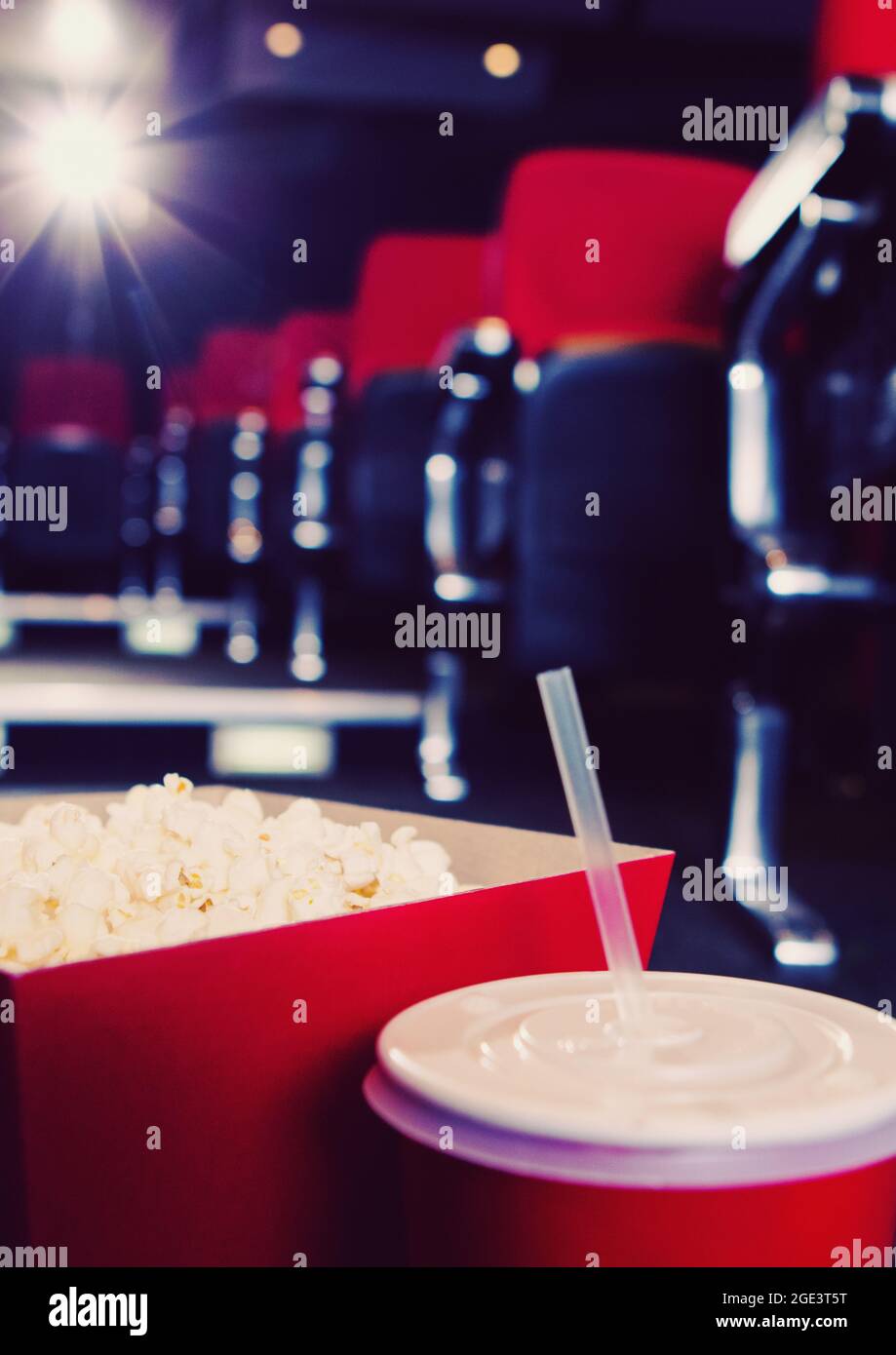 Composition of box of popcorn in cinema Stock Photo - Alamy