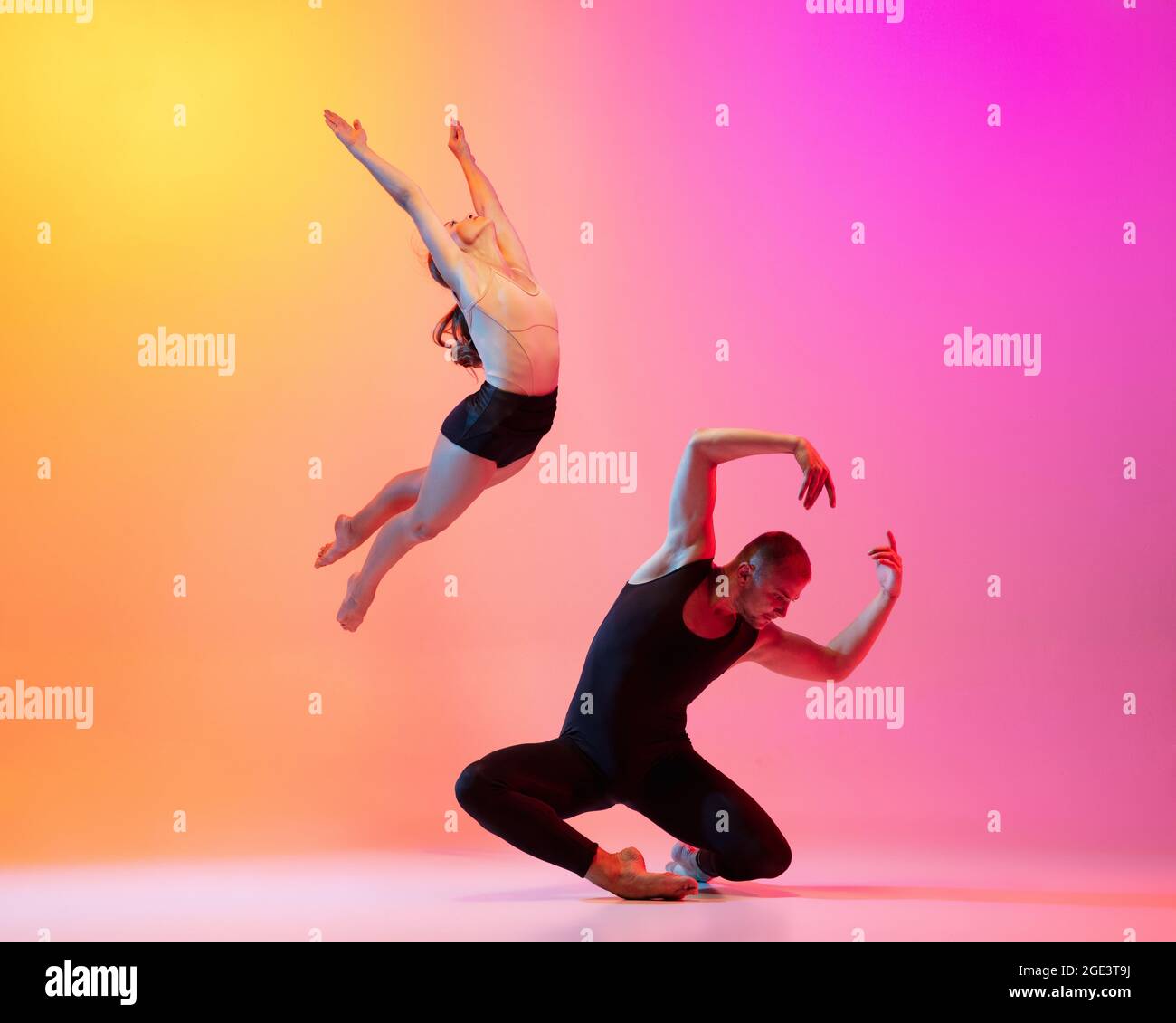 Two dancers, stylish sportive couple, male and female models dancing ...