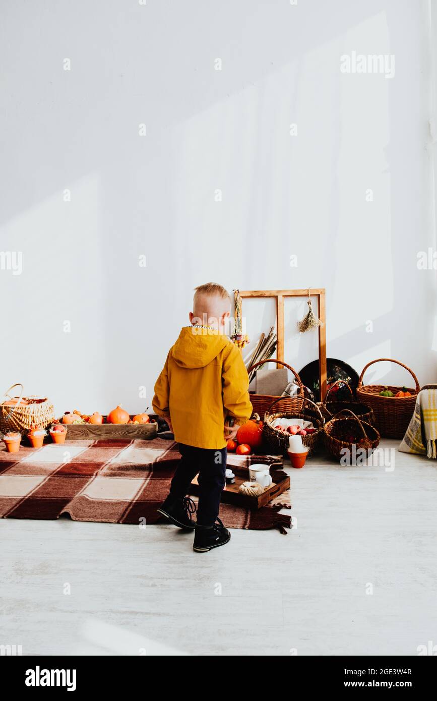 Cool trendy hipster boy 2 years old wears yellow jacket posing at the ...