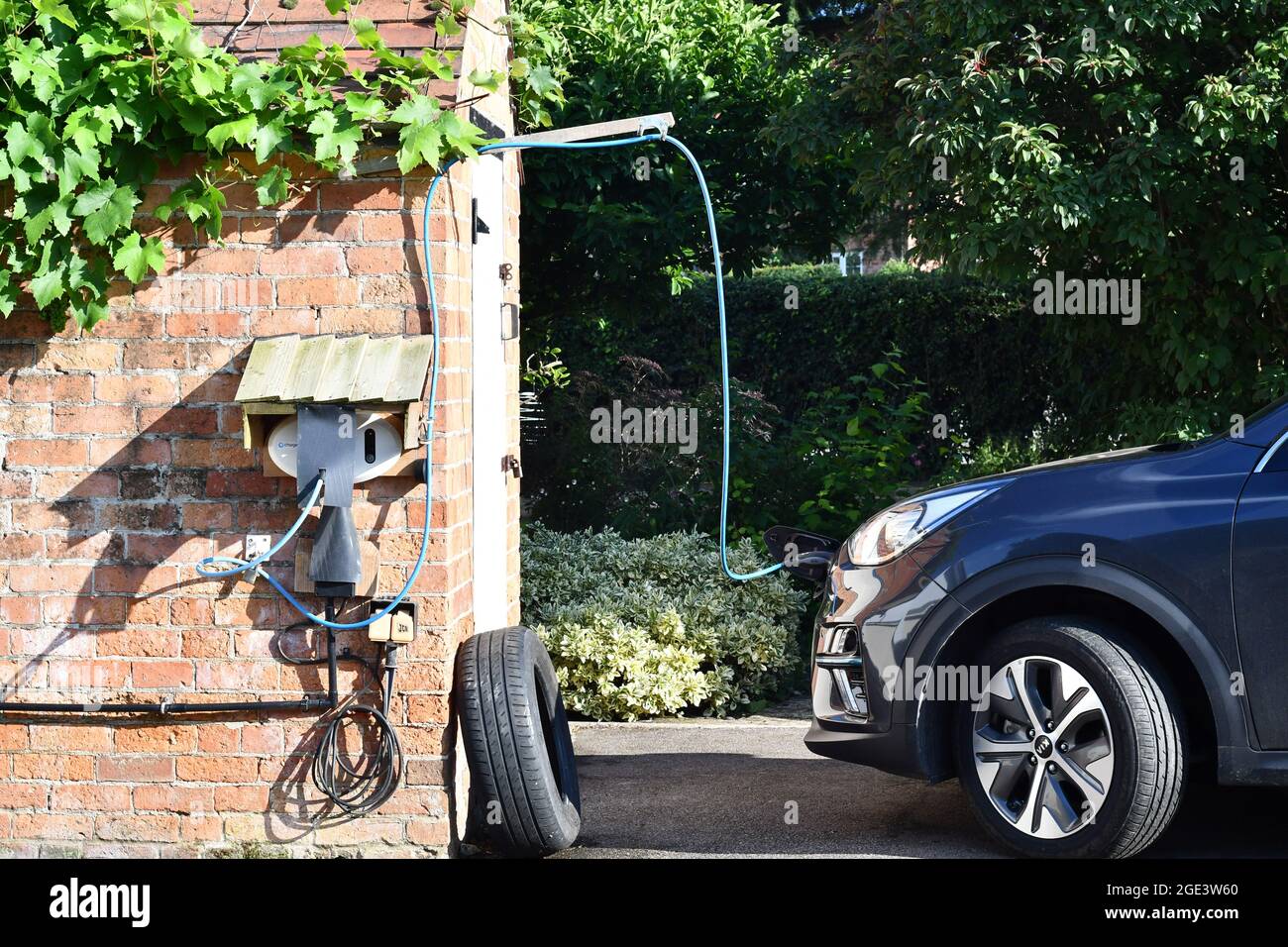 Rural Electric Car Charging point charging a fully electric car on a ...