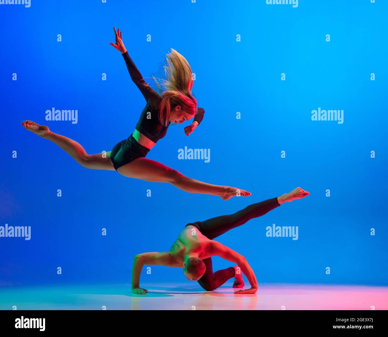 Stylish sportive caucasian couple, male and female dancer dancing ...