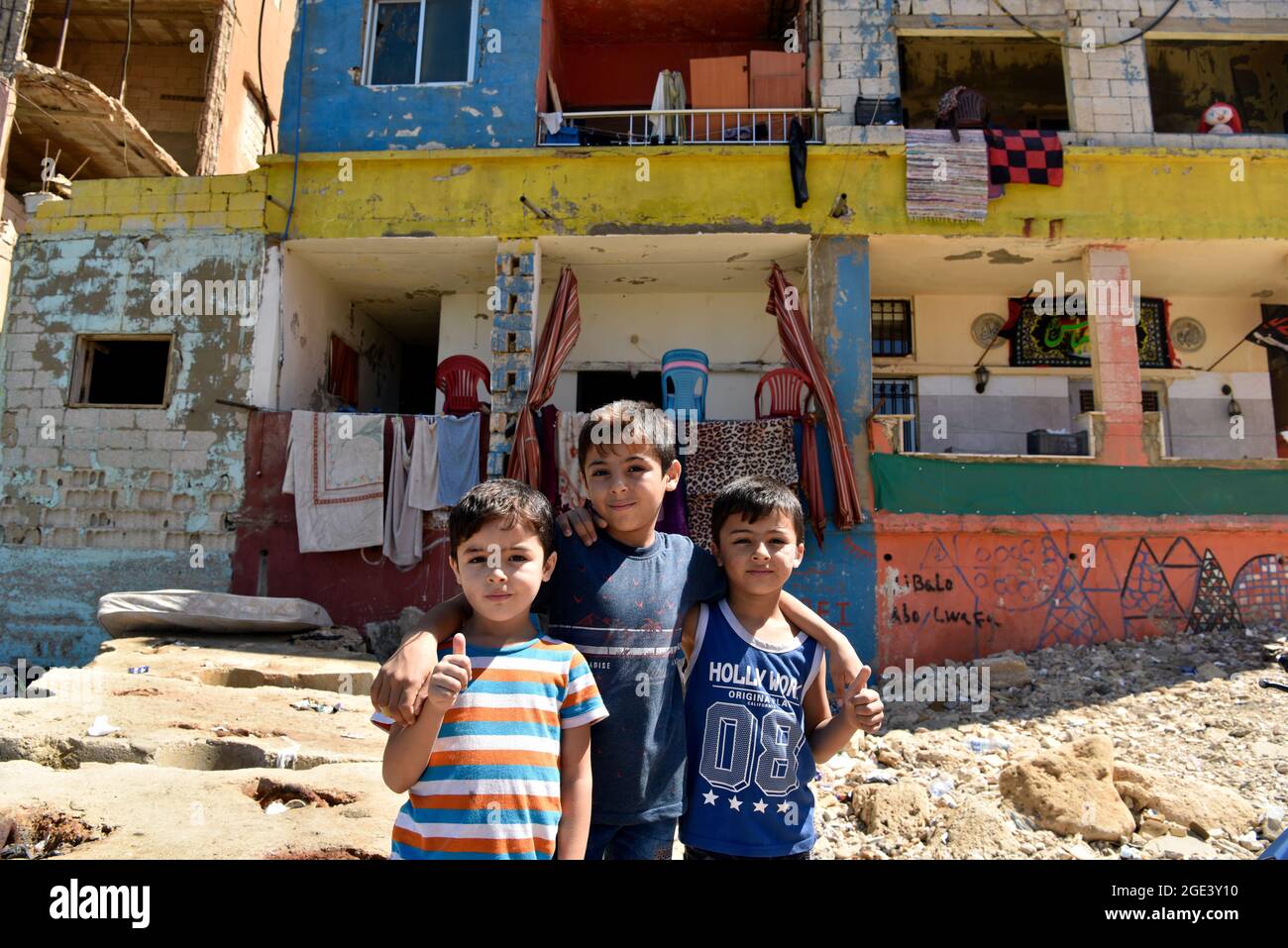 Youngsters posing for a photo in the poor neighbourhood of Ouzai ...