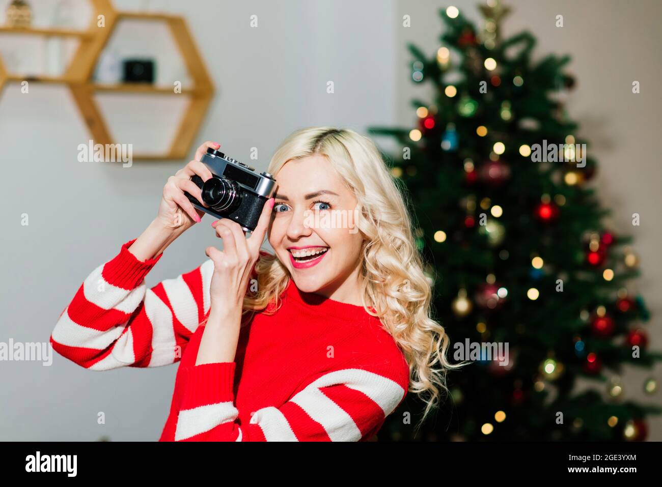 Woman holds camera lady photographer. Concept of happiness, new year ...