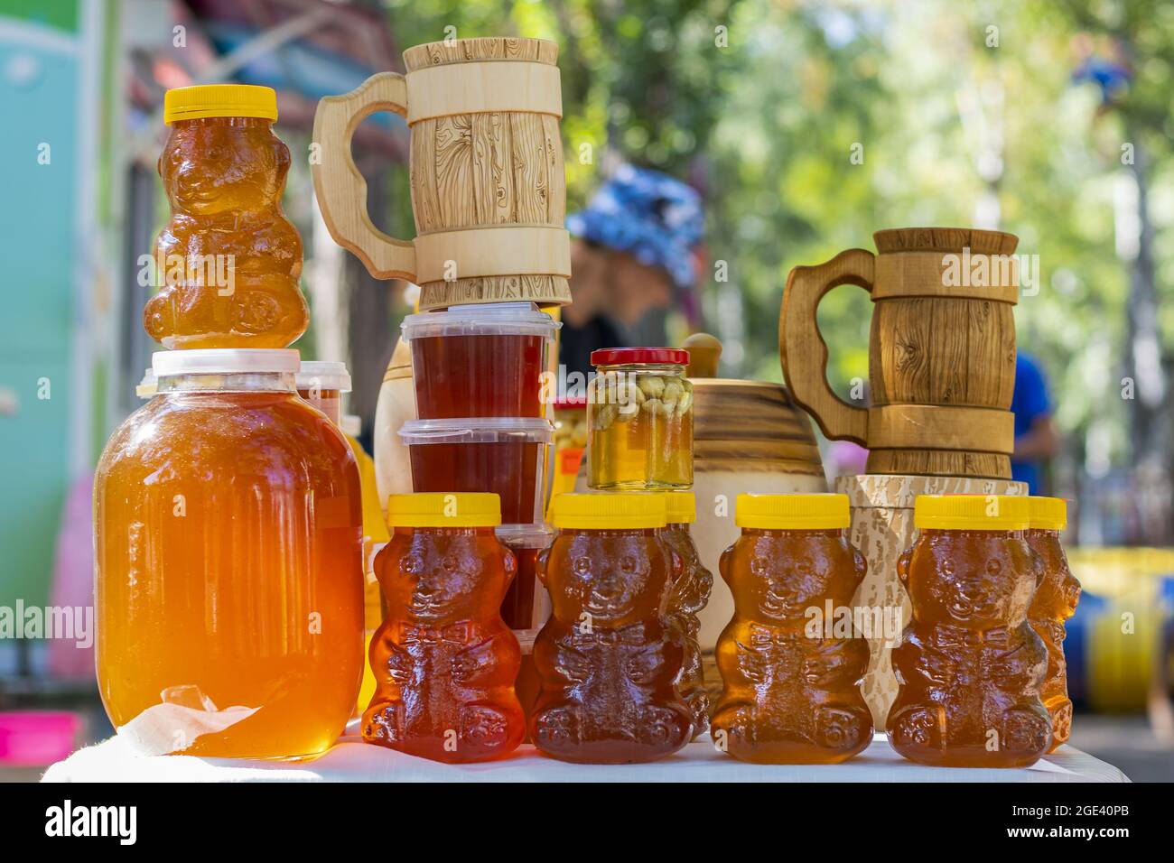 Bee honey is packaged in glass, plastic and wooden containers and is ...