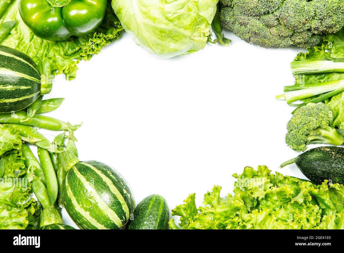 Green vegetables on white background with copy space Stock Photo - Alamy