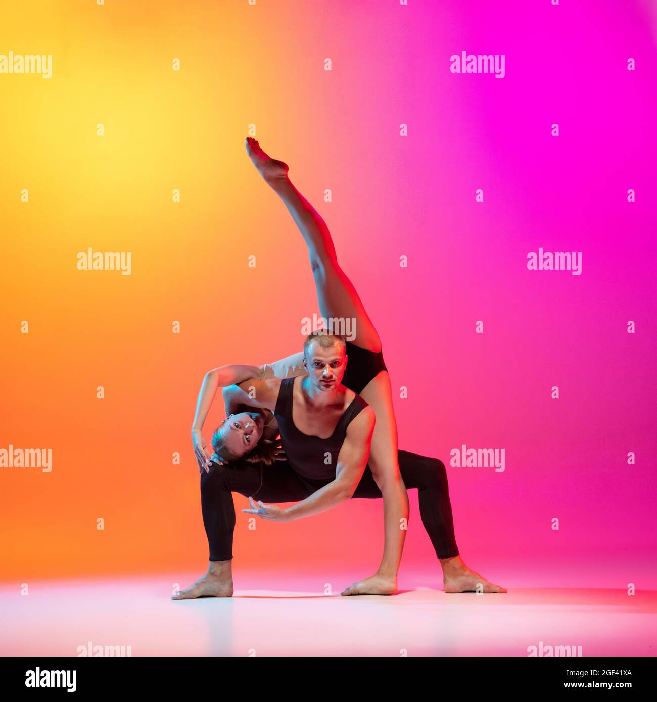 Art performance. Two dancers, stylish sportive couple, male and female ...