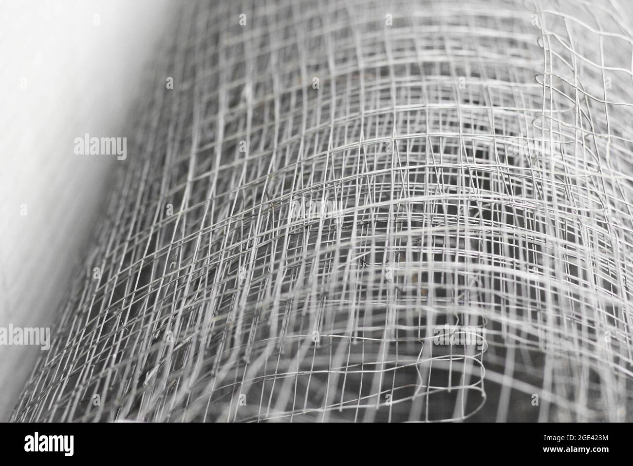 Roll of mesh. Metal grid. Construction material Stock Photo - Alamy