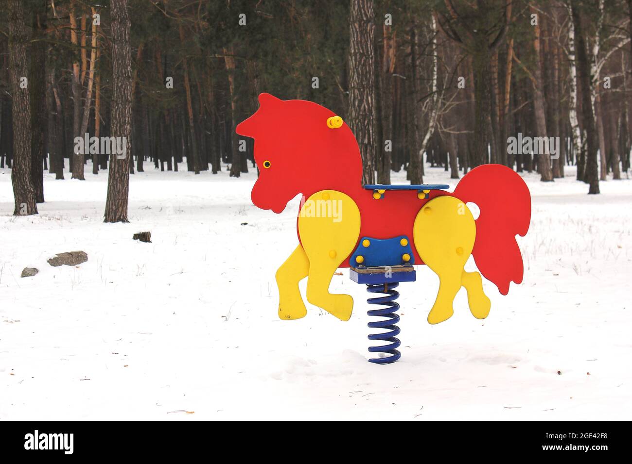 Children's swing. Winter. Playground. Children's playground is empty in ...