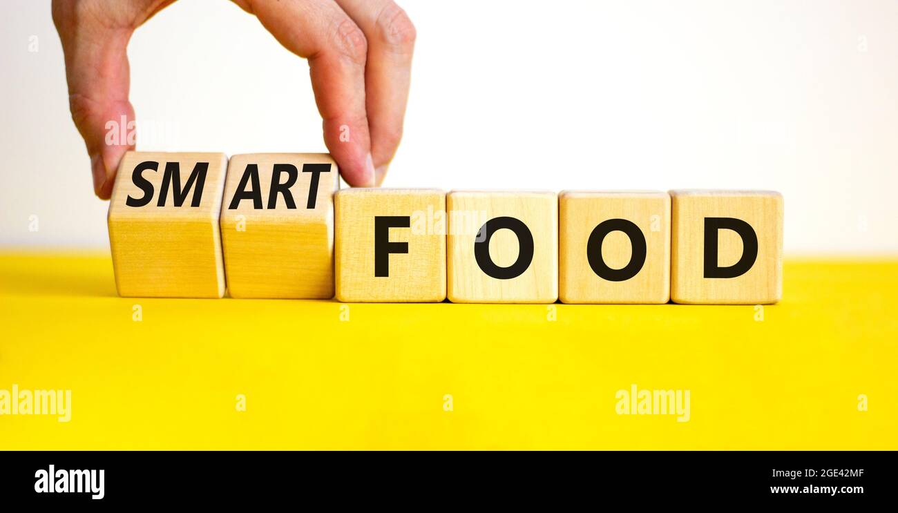 Smart food symbol. Doctor turns cubes and changes words 'food' to ...