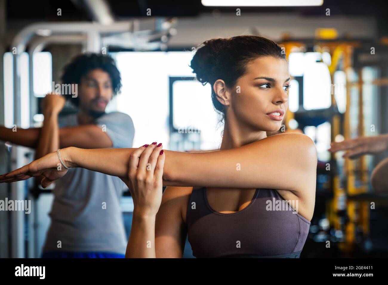 Happy diverse people exercise together in gym to stay healthy Stock ...