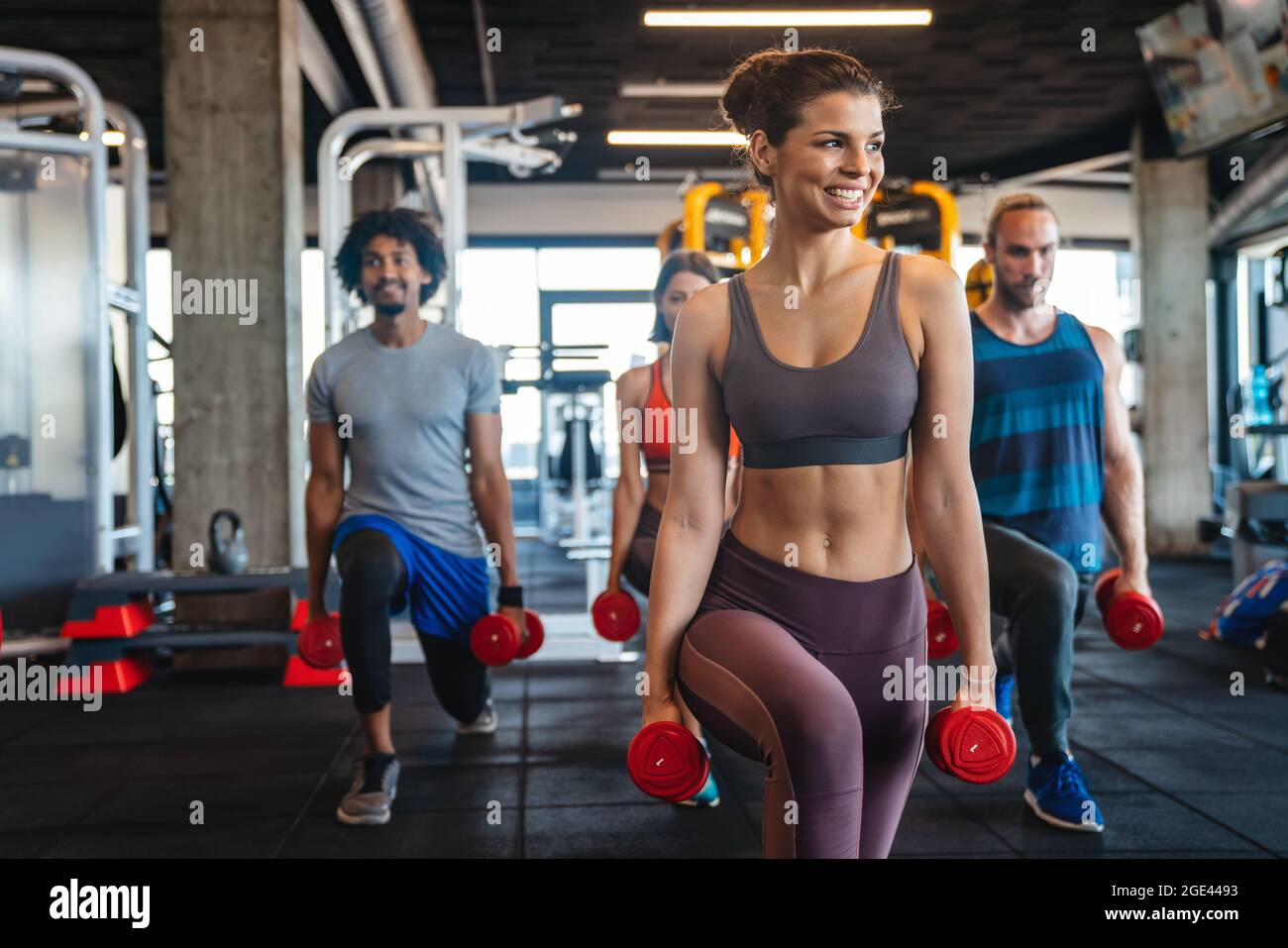 Happy diverse people exercise together in gym to stay healthy Stock ...