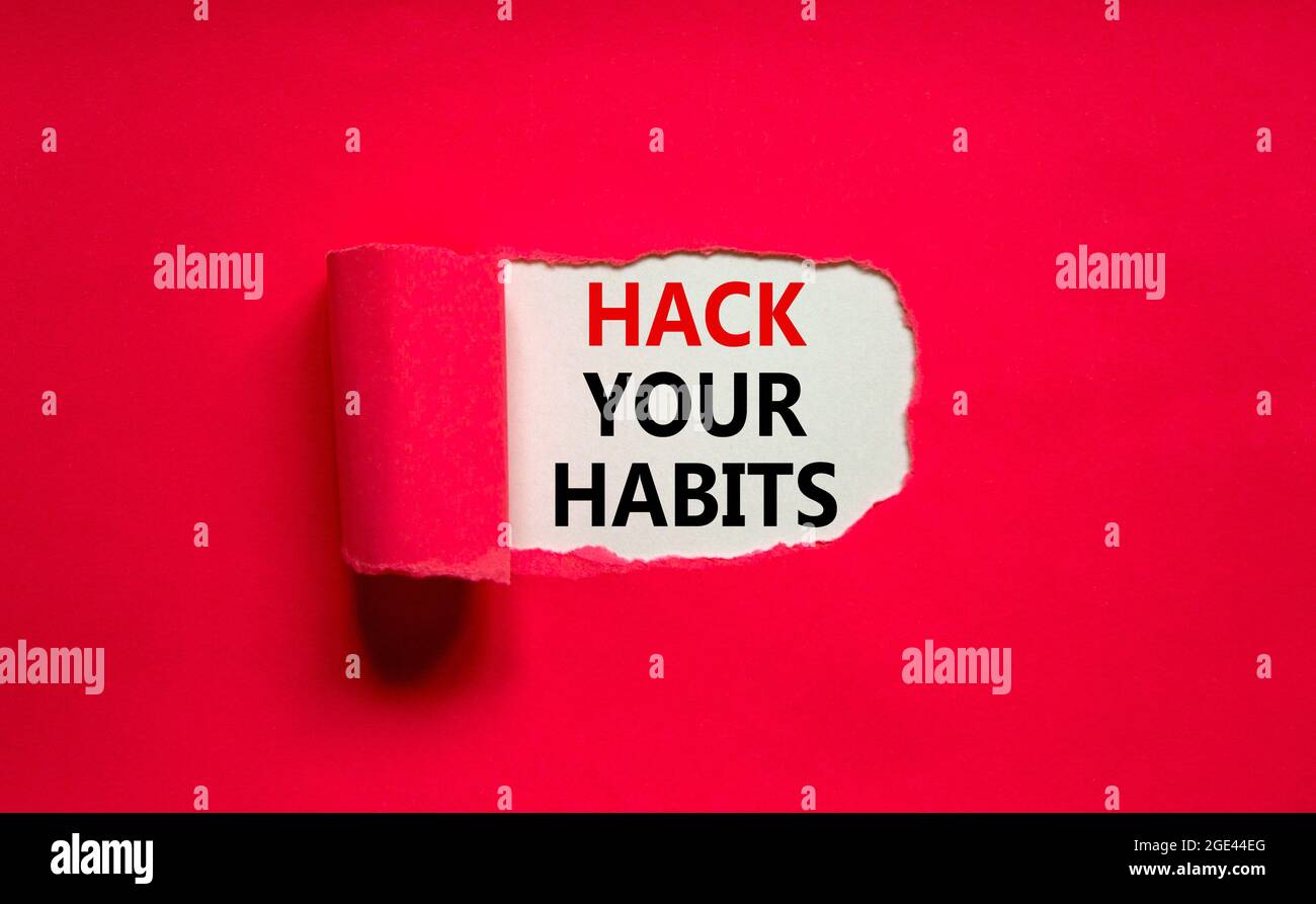 Hack your habits symbol. Words 'Hack your habits' appearing behind torn ...