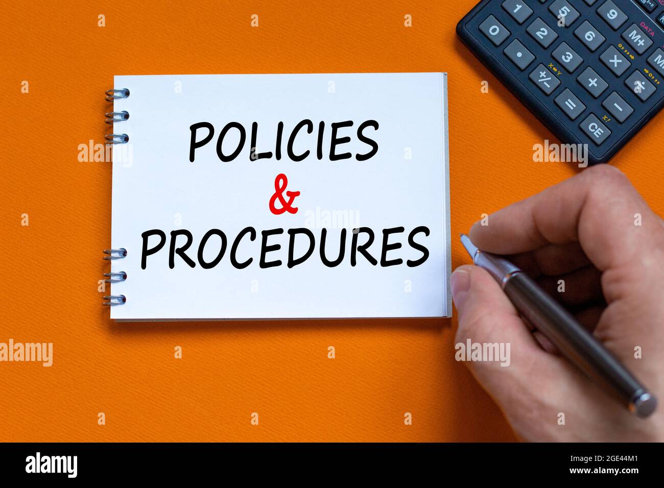 Policies and procedures symbol. Businessman writing words 'Policies and ...