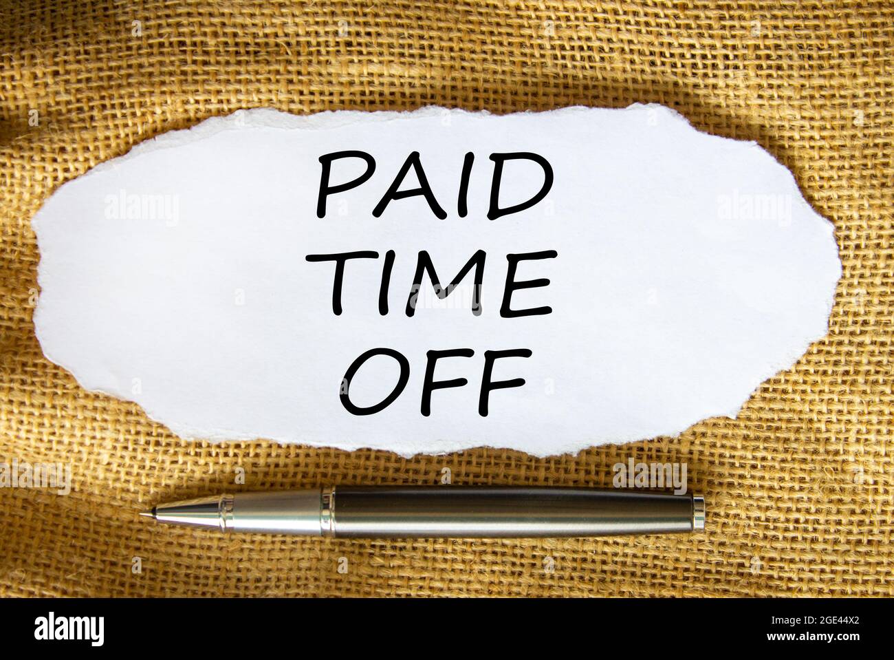 Paid time off symbol. Words 'Paid time off' on white paper. Black ...