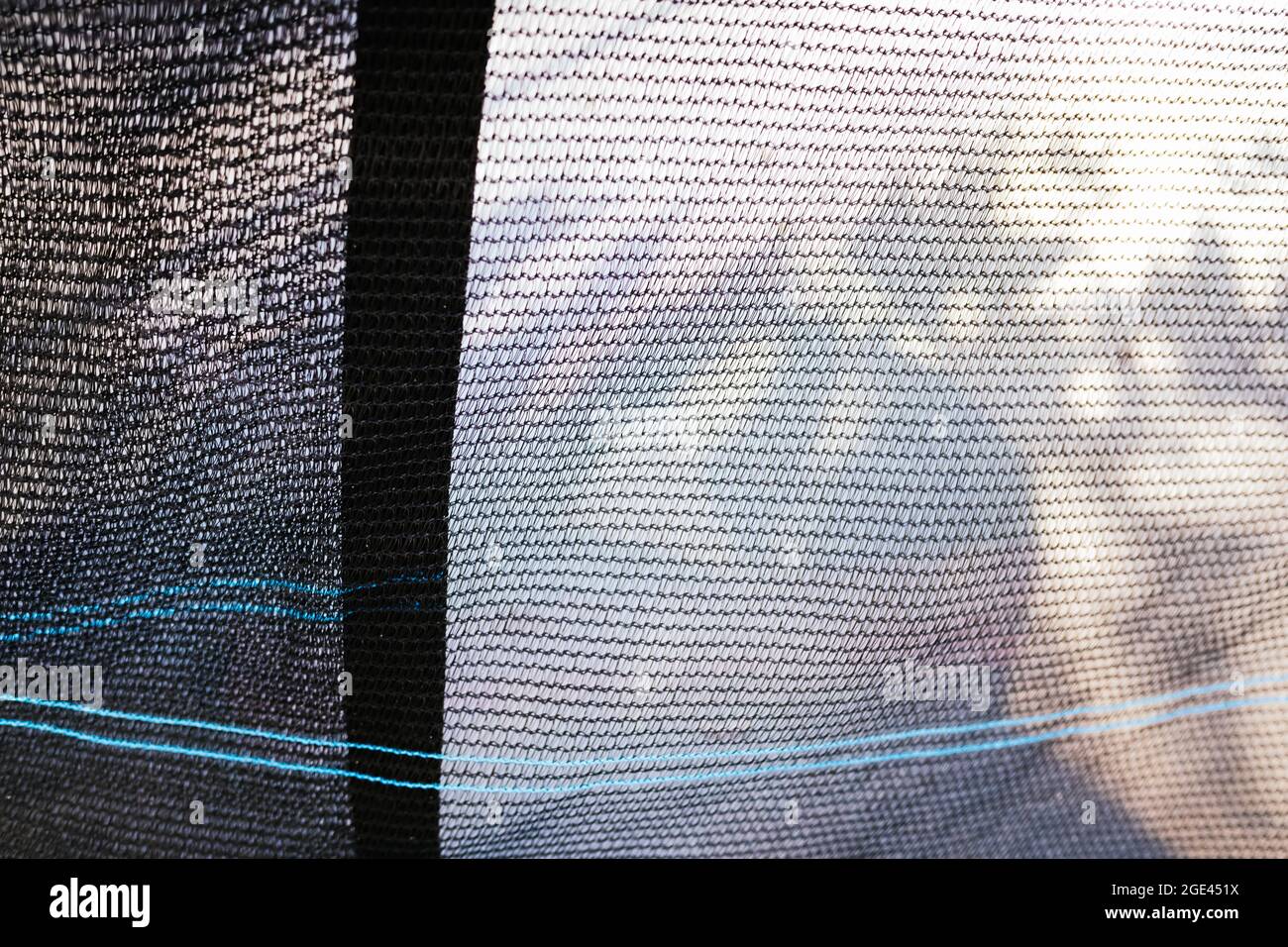 A black nylon mesh in the field to protect yourself from birds and ...