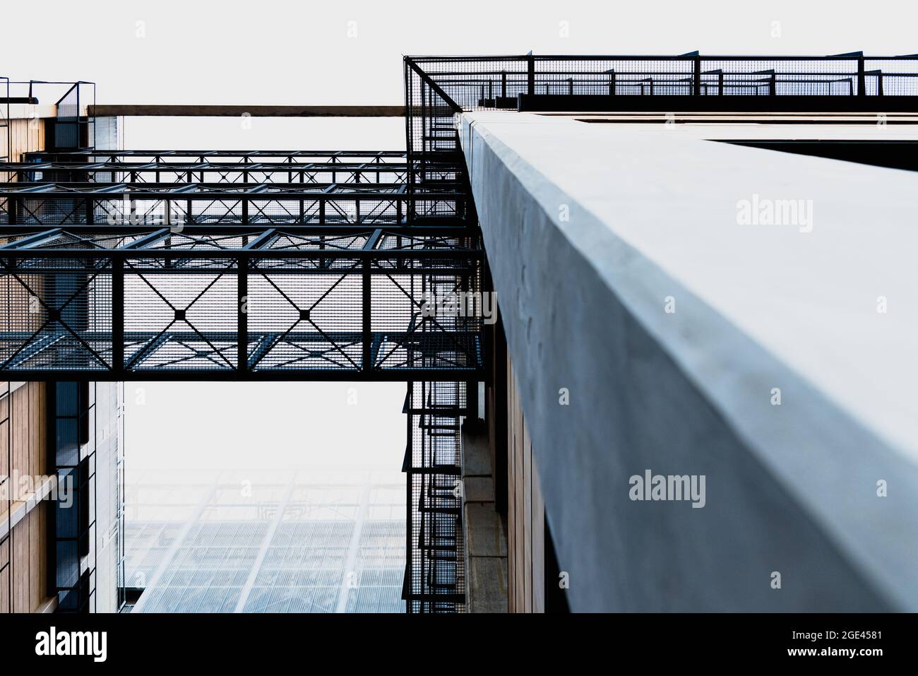 Metal mesh on steel walkways between buildings to communicate Stock ...