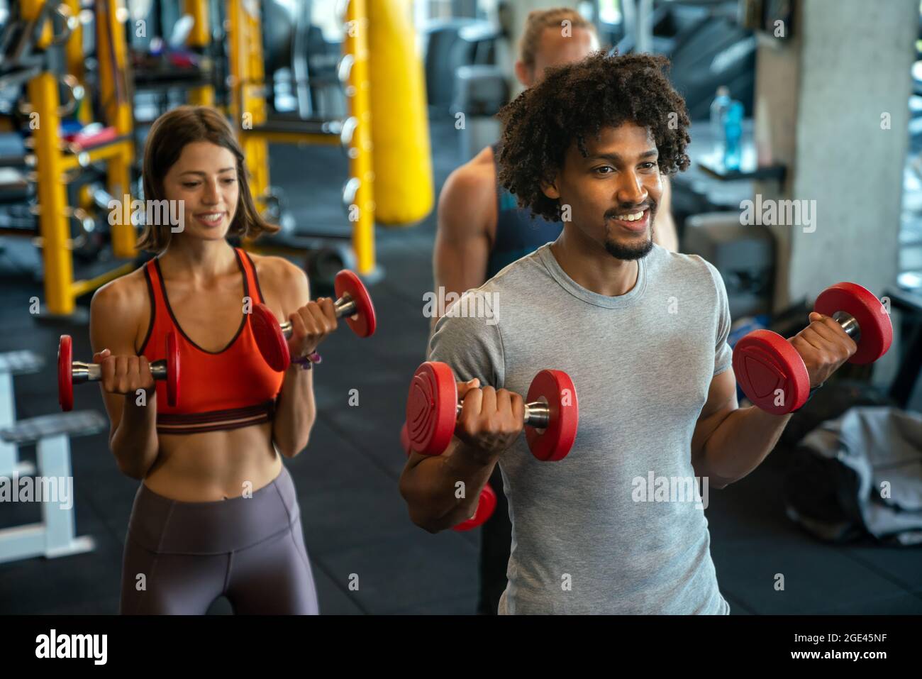 Happy diverse people exercise together in gym to stay healthy Stock ...