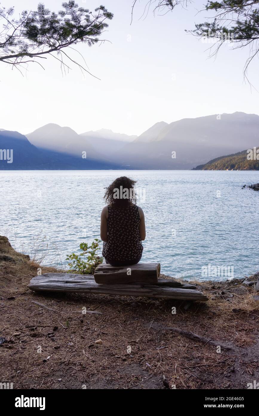 Adventurous Adult Caucasian Woman enjoying the scenery of Howe Sound ...