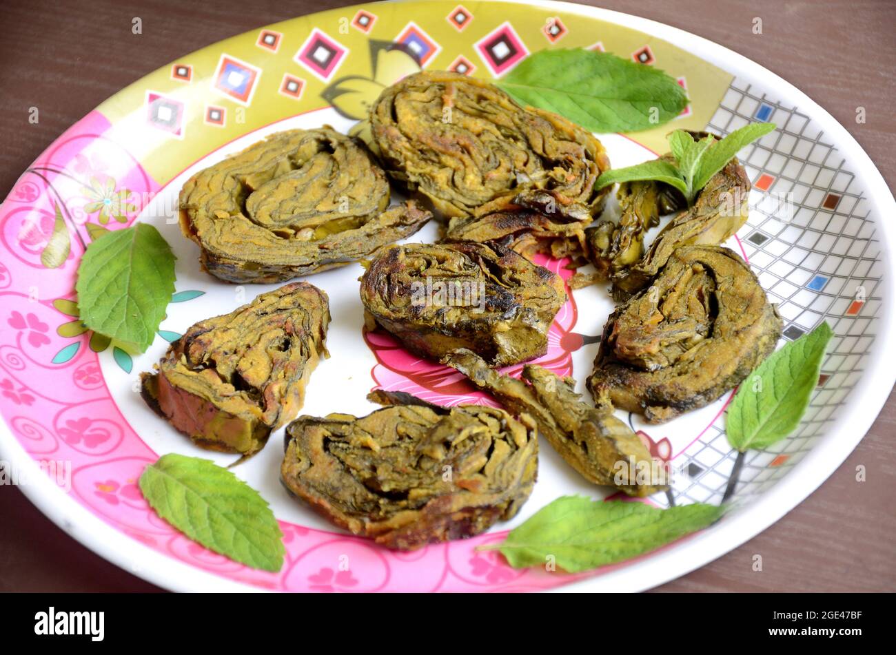 Closeup the fried arabic leaves food with green mint in the plate on ...