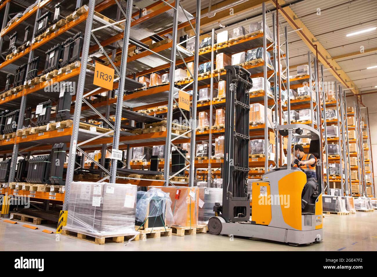 Hamburg, Germany. 04th Aug, 2021. A man works with a forklift between ...
