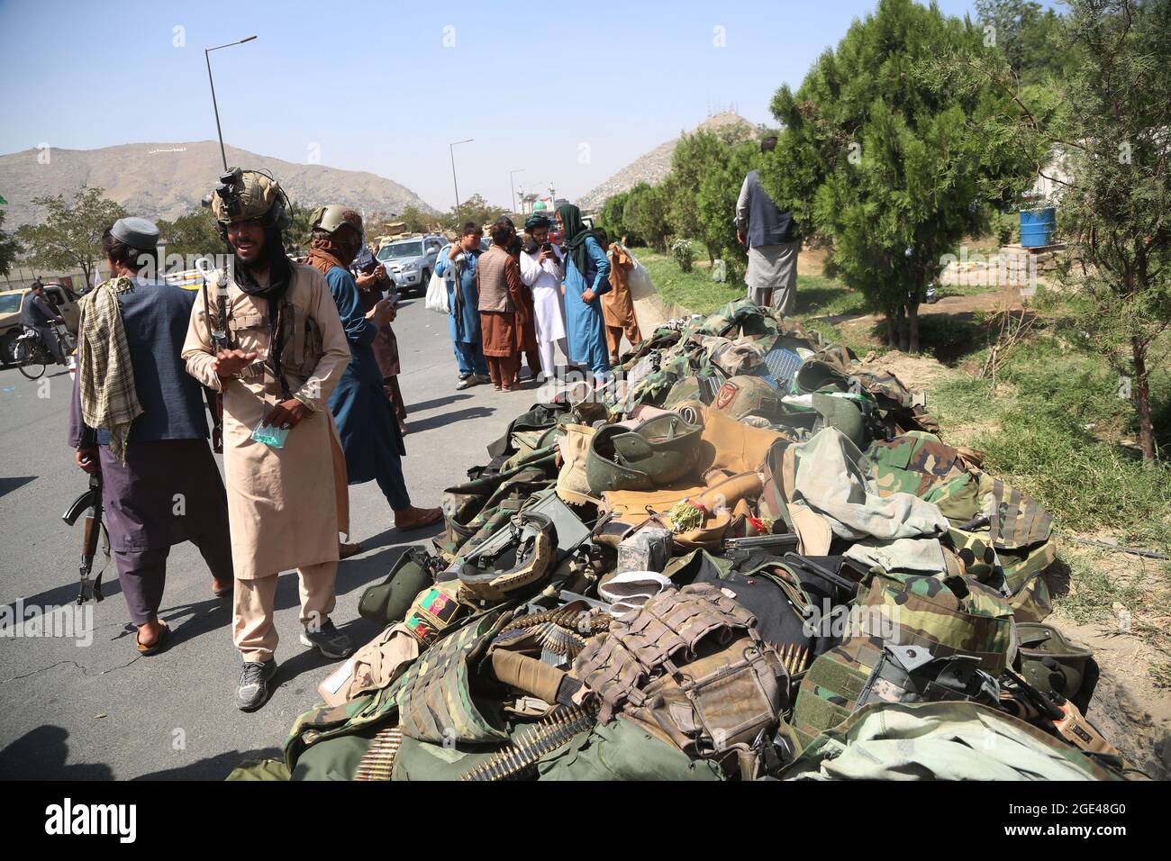 Kabul, Afghanistan. 16th Aug, 2021. Taliban fighters stand beside the ...