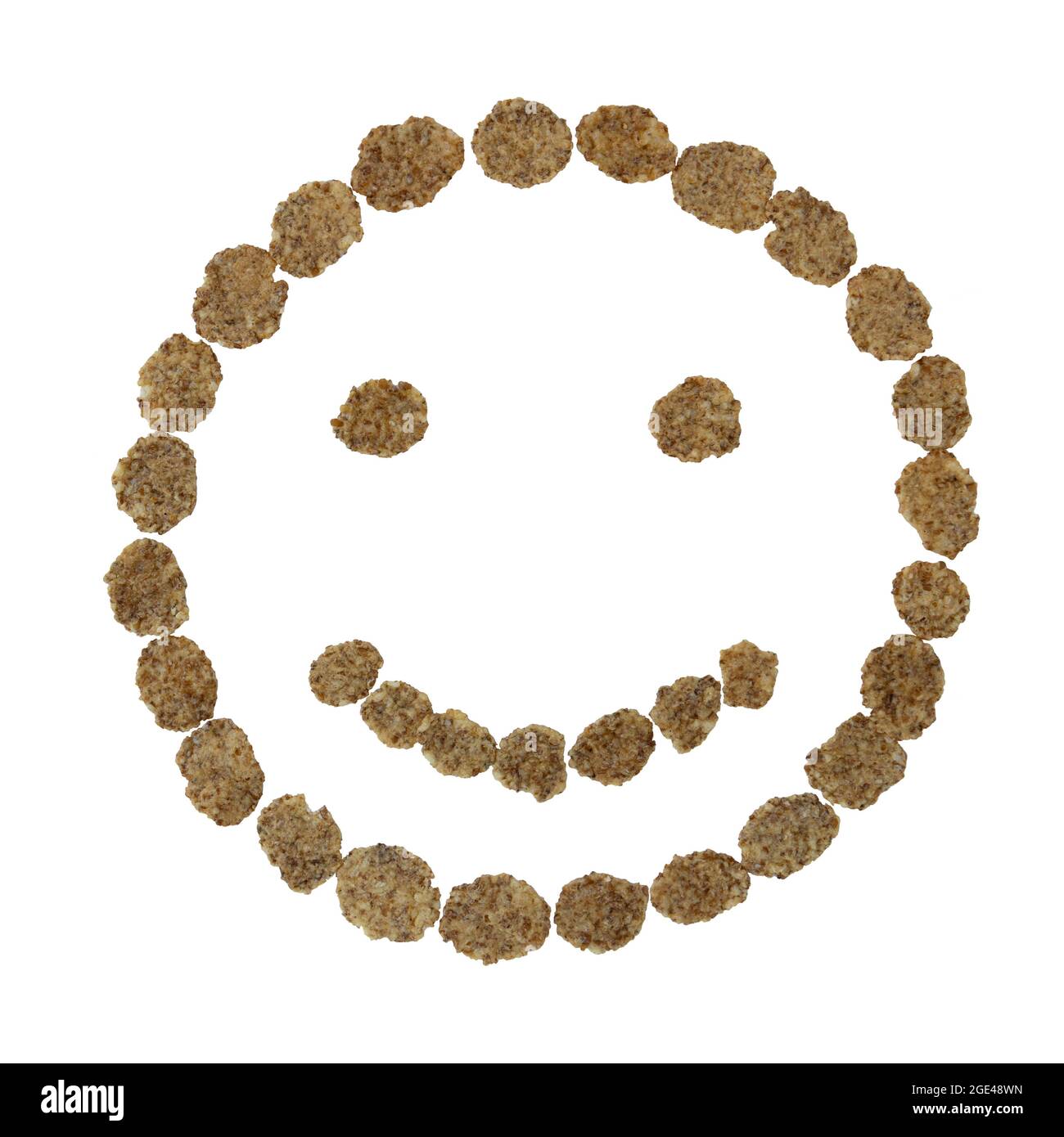 cereal muesli breakfast in the shape of smiling face on white ...
