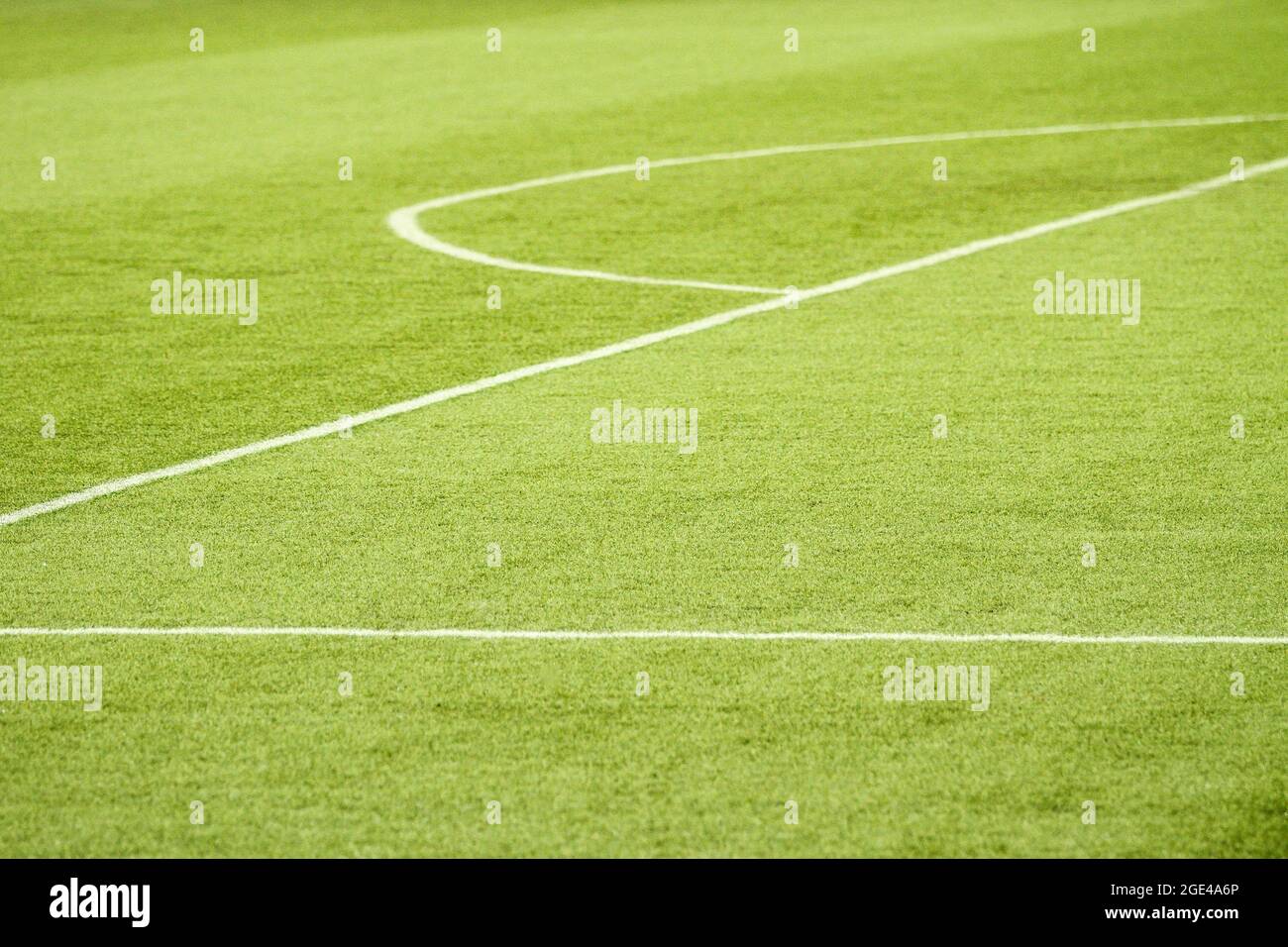 Large area of a football field, with its white lines, the half moon and ...