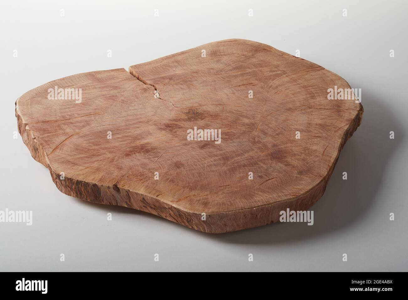 Rustic wooden cutting board on a white surface Stock Photo - Alamy