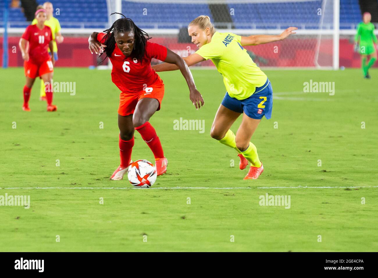 August 06, 2021: Deanne Rose (6) of Canada runs with the ball pursued ...