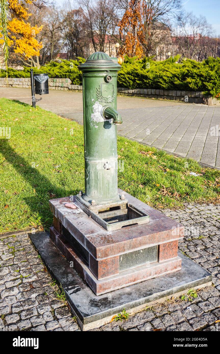 POZNAN, POLAND - Nov 21, 2016: An old metal unused water pump at a park ...