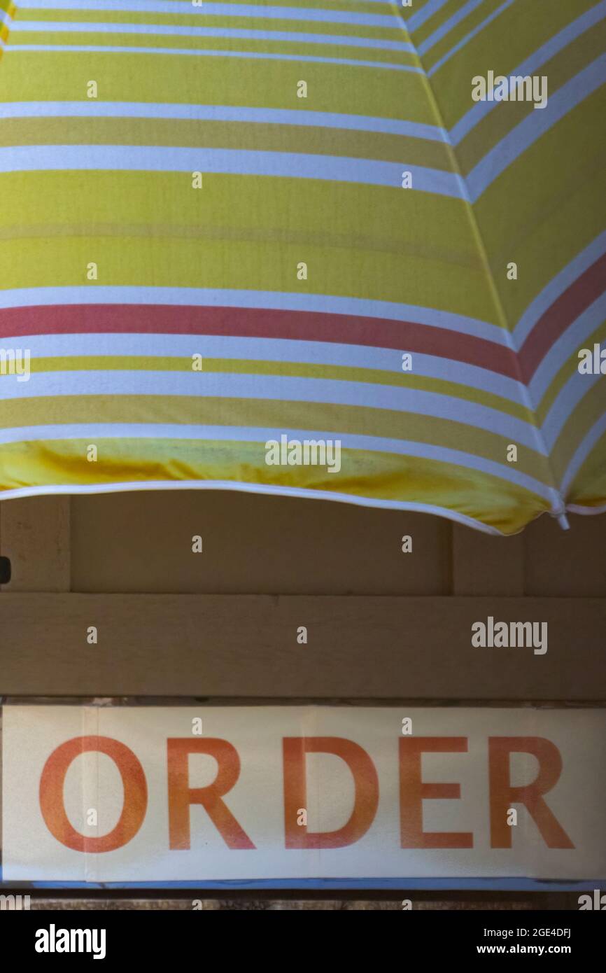 sign above window labels order location for outdoor cafe Stock Photo ...