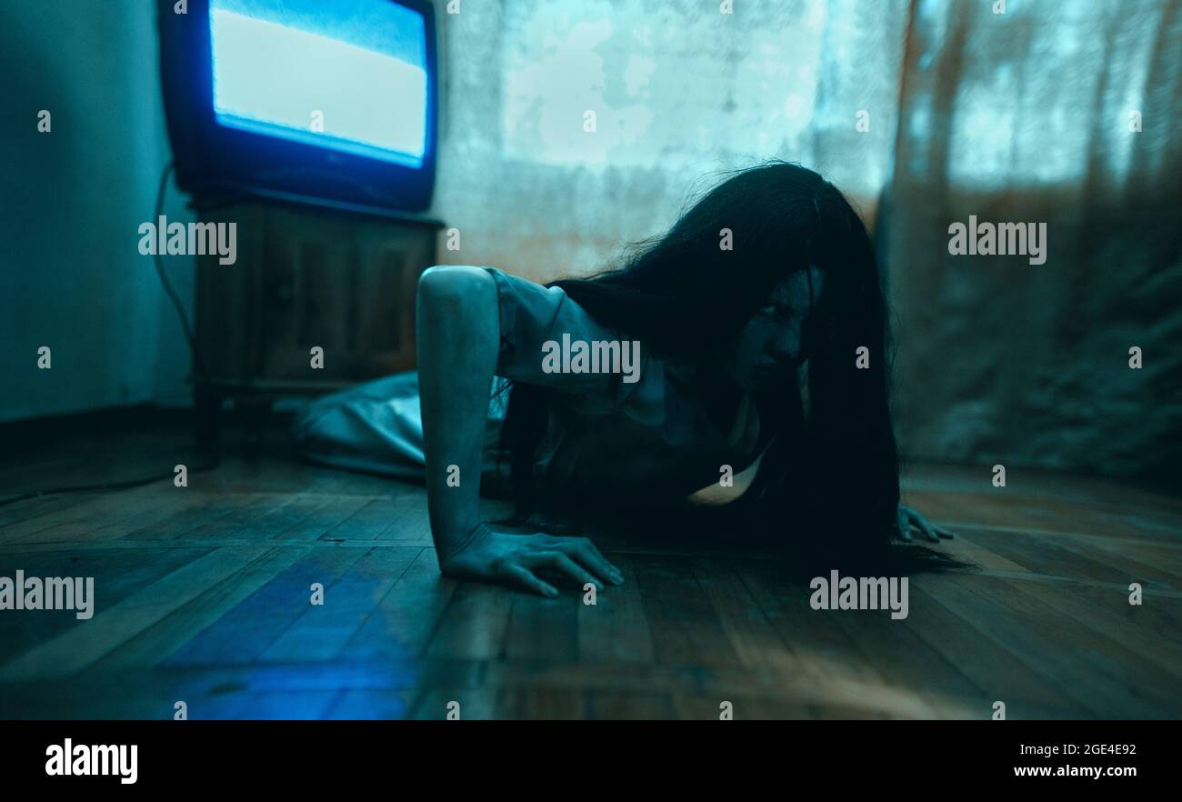 Girl with long black hair in image of scary ghost zombie crawls on ...