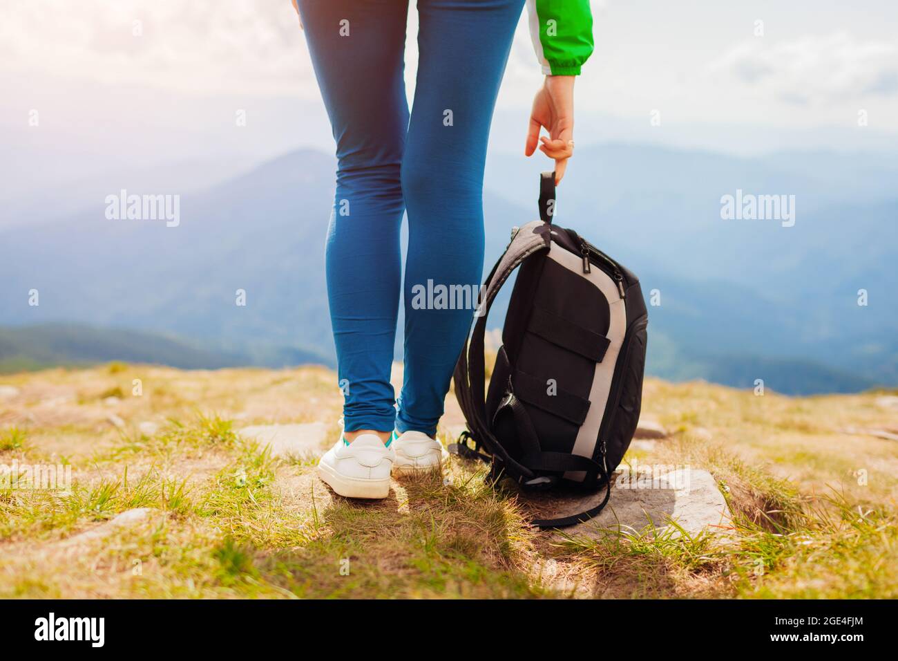 Hiking in Carpathian mountains. Hiker woman carrying backpack enjoying ...
