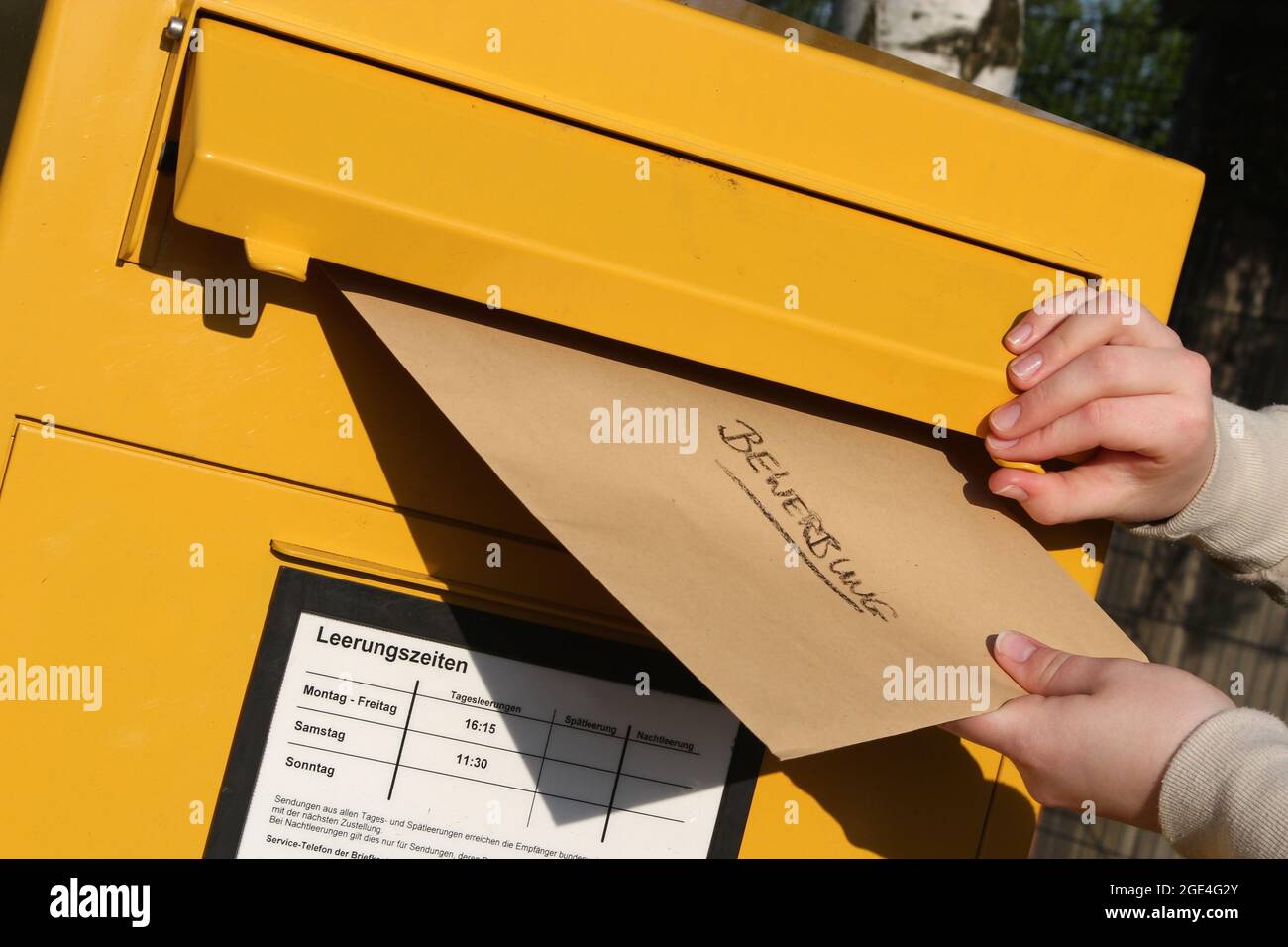 posting a letter with application documents Stock Photo - Alamy