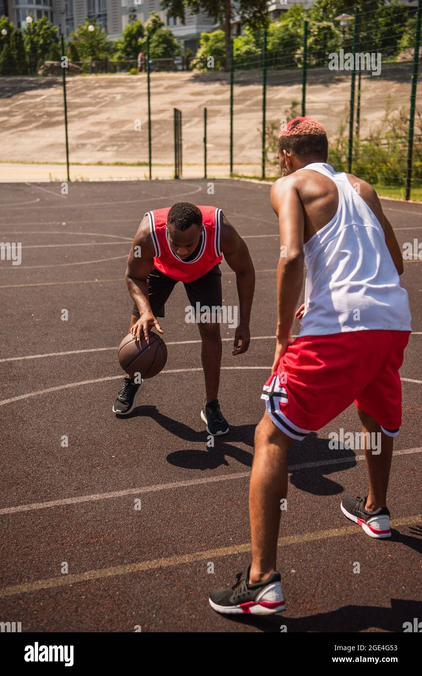 African american men playing basketball on playground Stock Photo - Alamy
