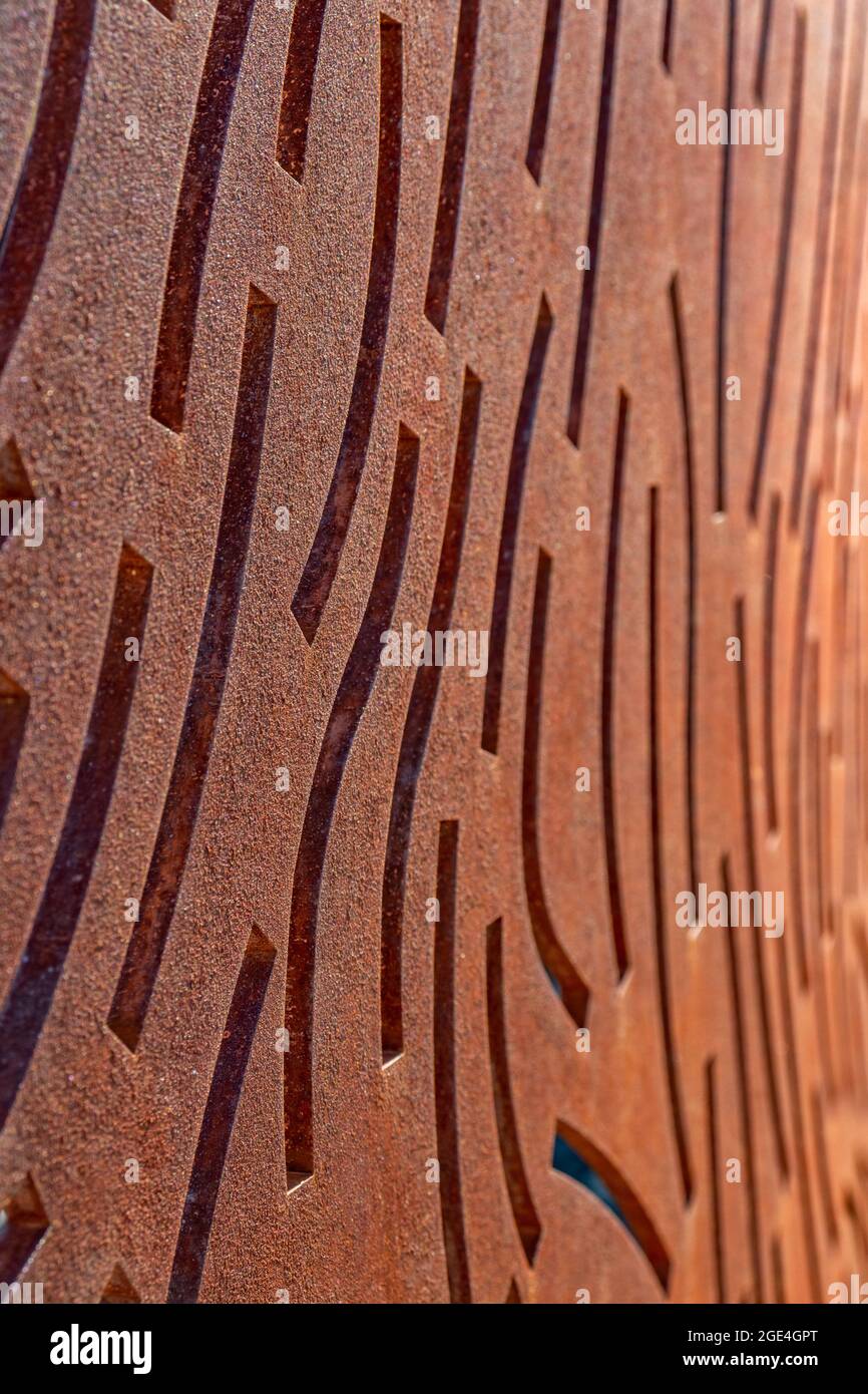 Rust orange cut out patterned metal with faded background for graphics ...