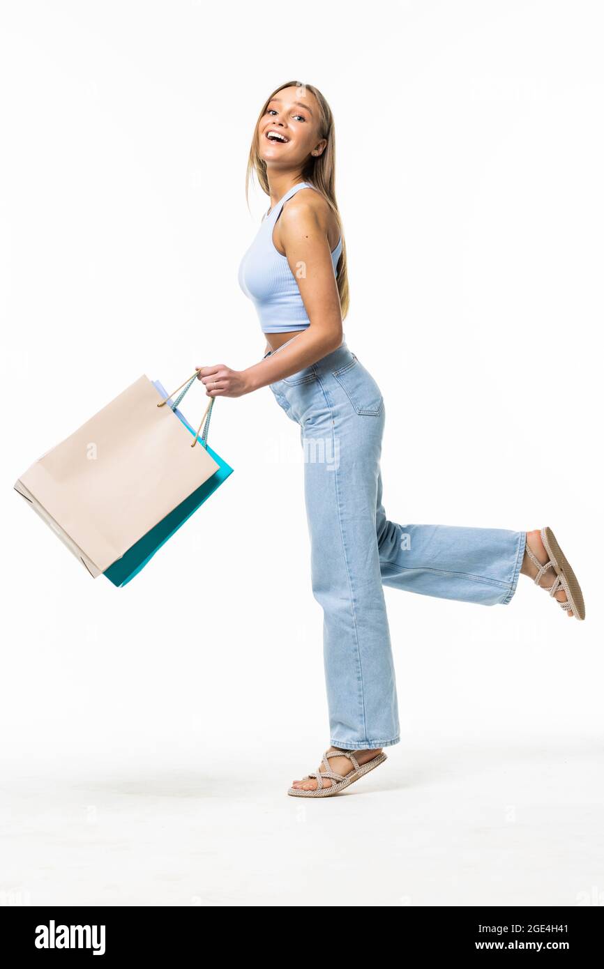 Let's start the sale shopping. Woman walking with shopping bag isolated ...