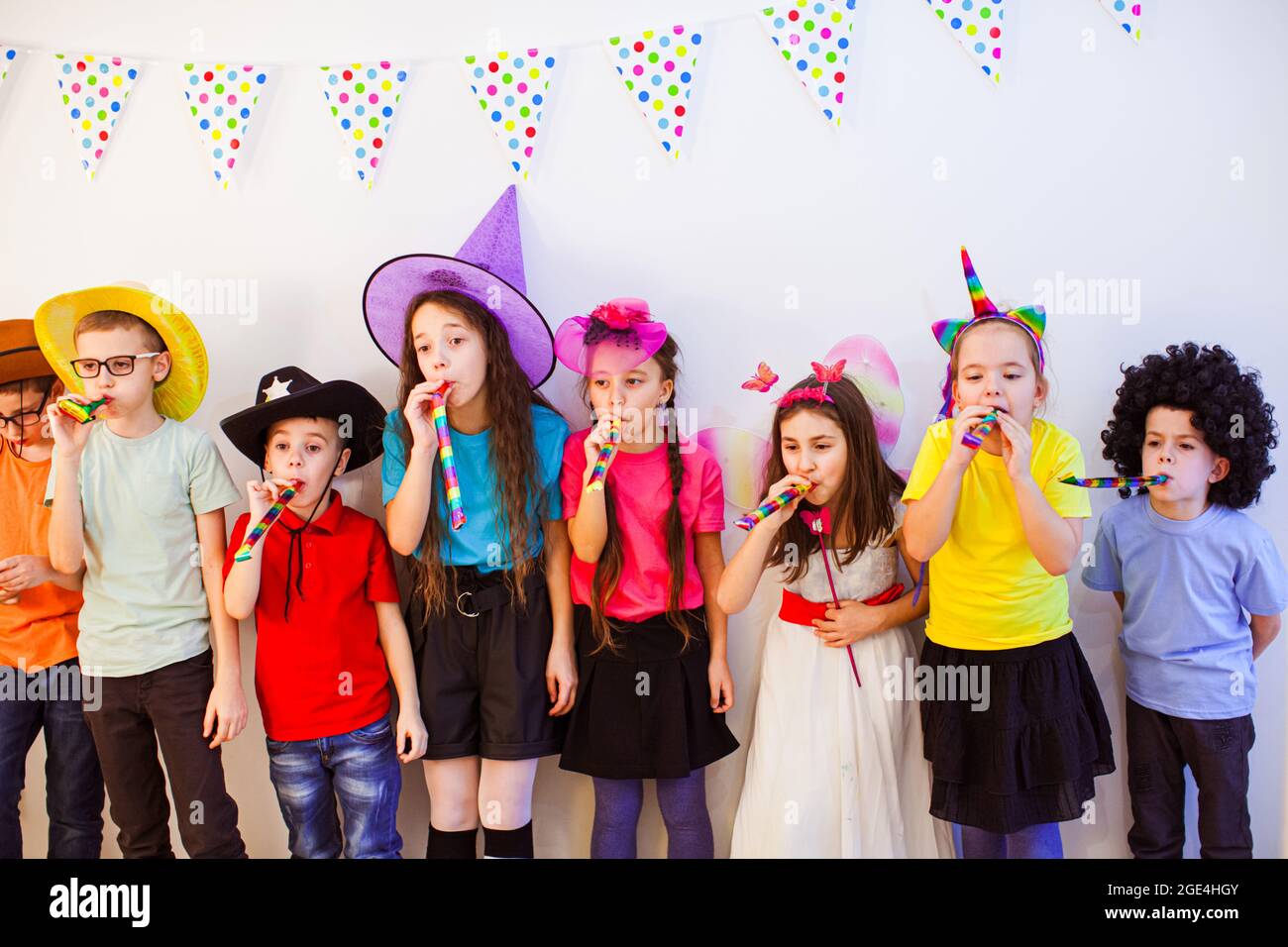 Cheerful kids having good time at Birthday party Stock Photo - Alamy