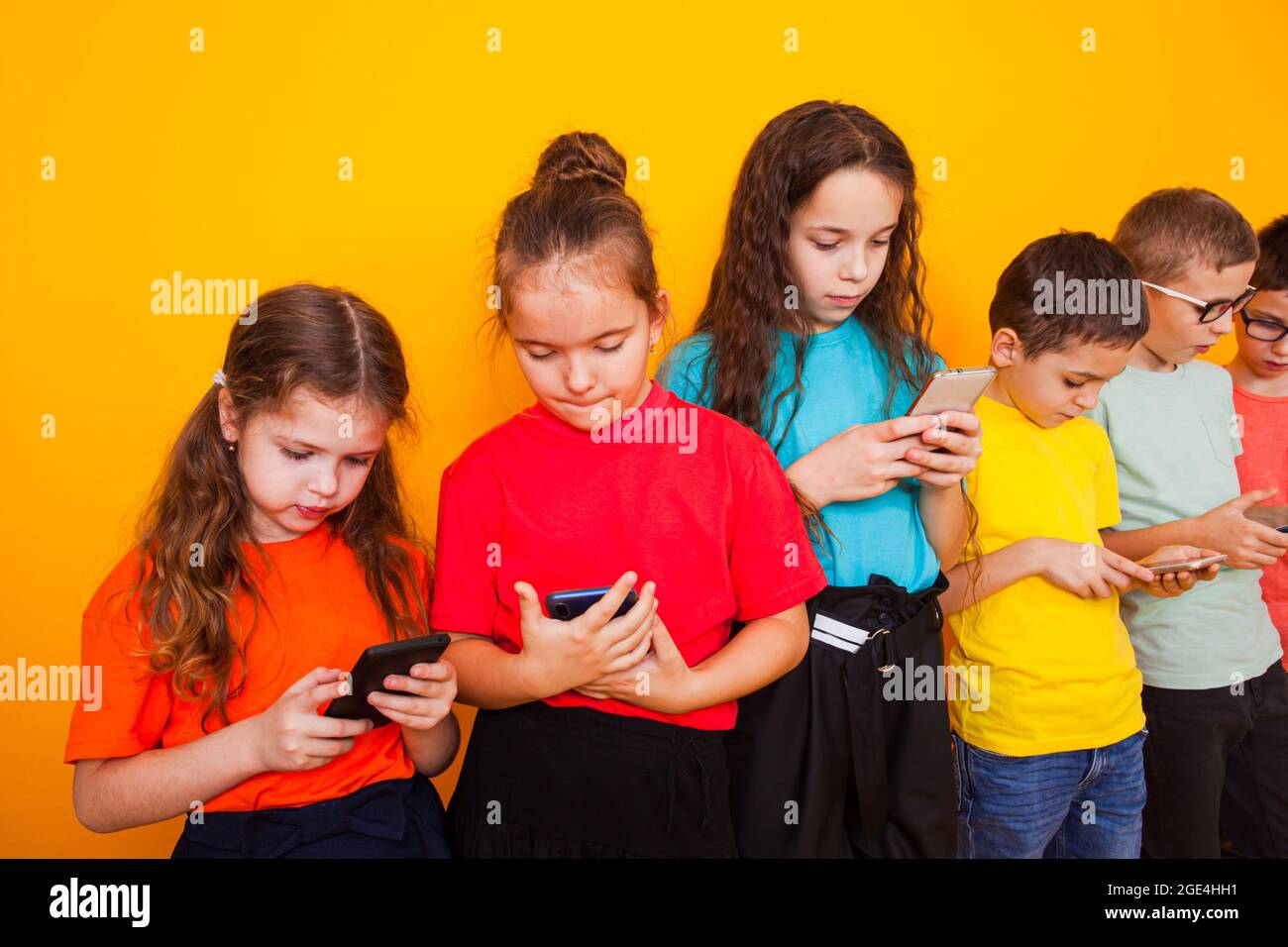 Young kids playing game on mobile phone Stock Photo - Alamy