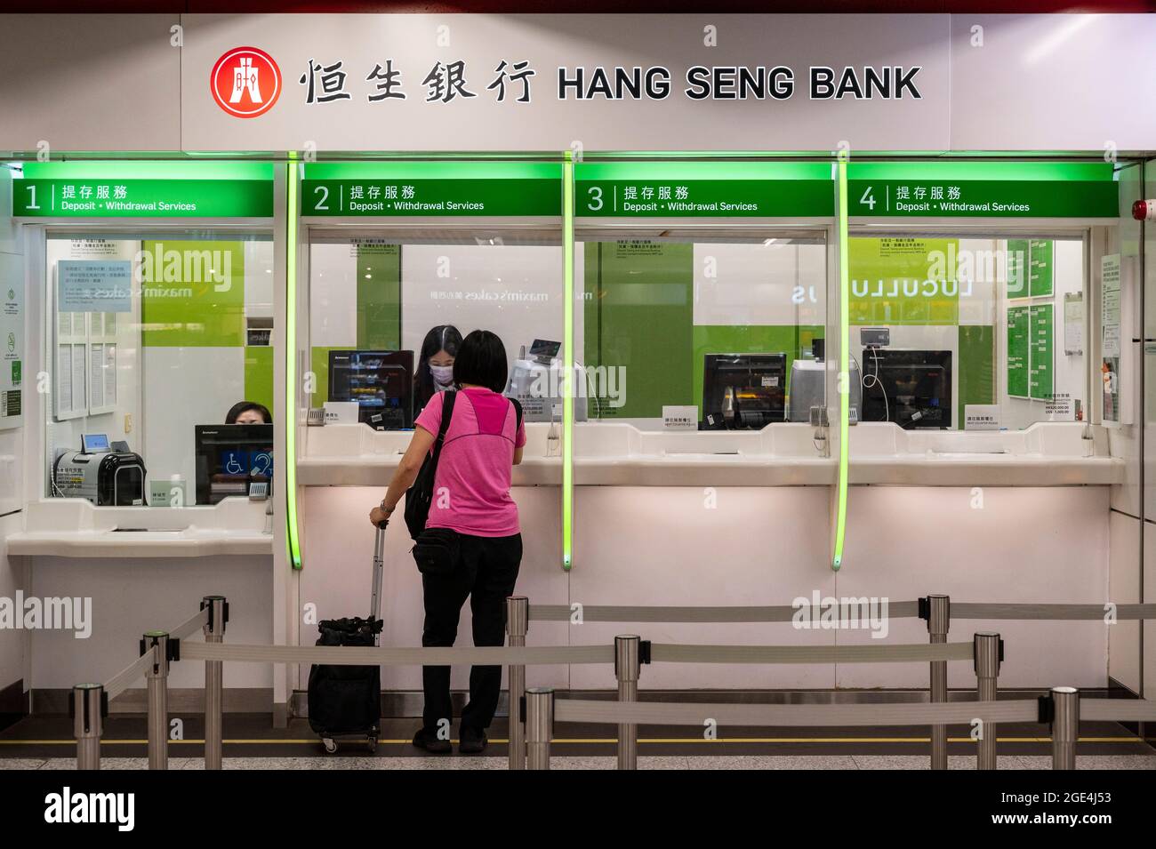A customer is seen at a Hang Seng Bank branch in Hong Kong. (Photo by ...