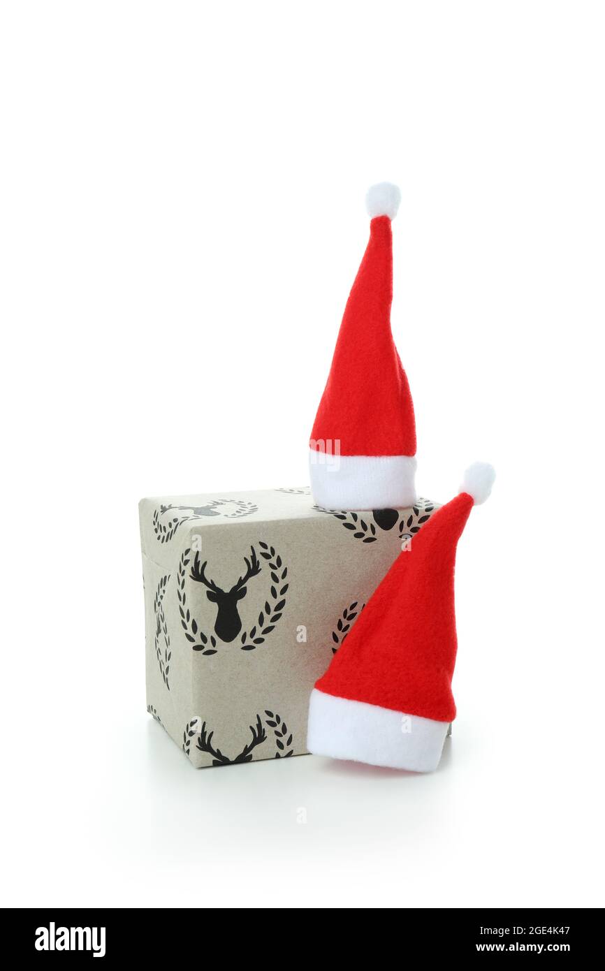 Christmas boxes and Santa hats isolated on white background Stock Photo ...