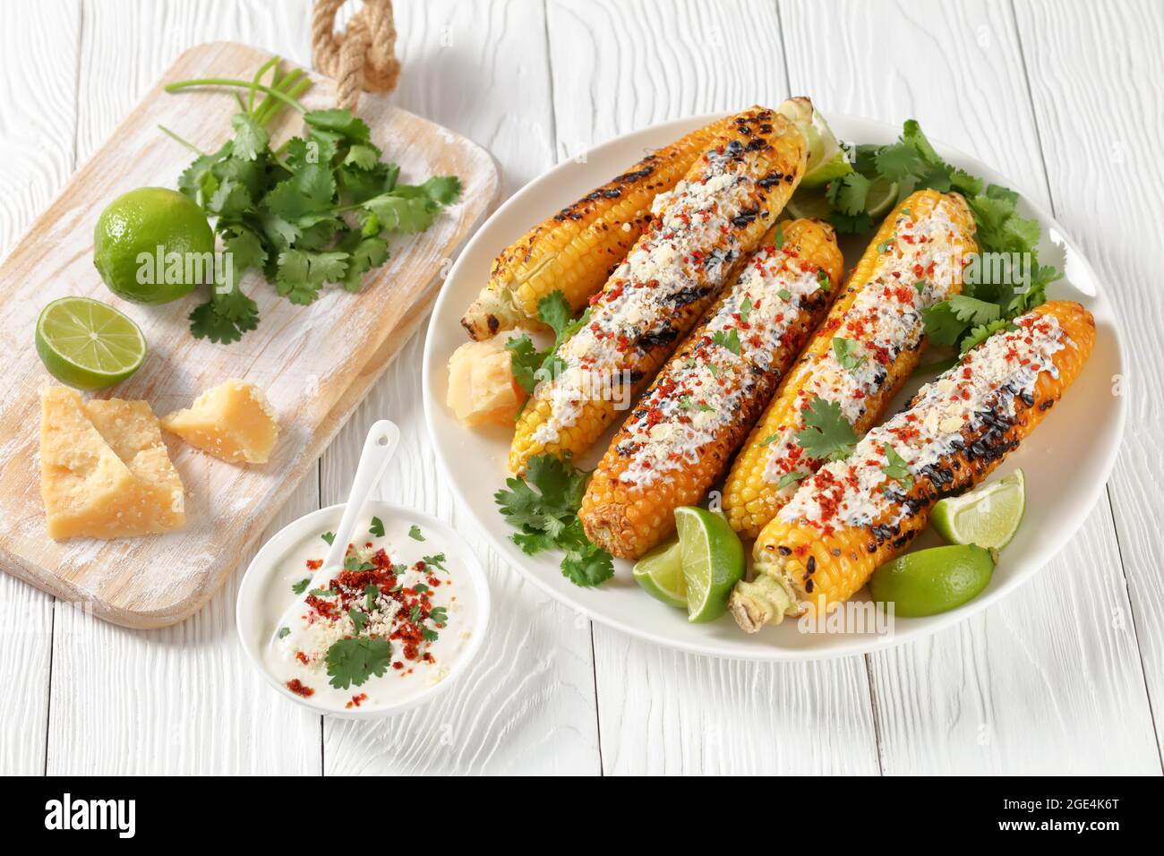 Elotes, Grilled Mexican Street Corn, charred cobs are covered in creamy ...